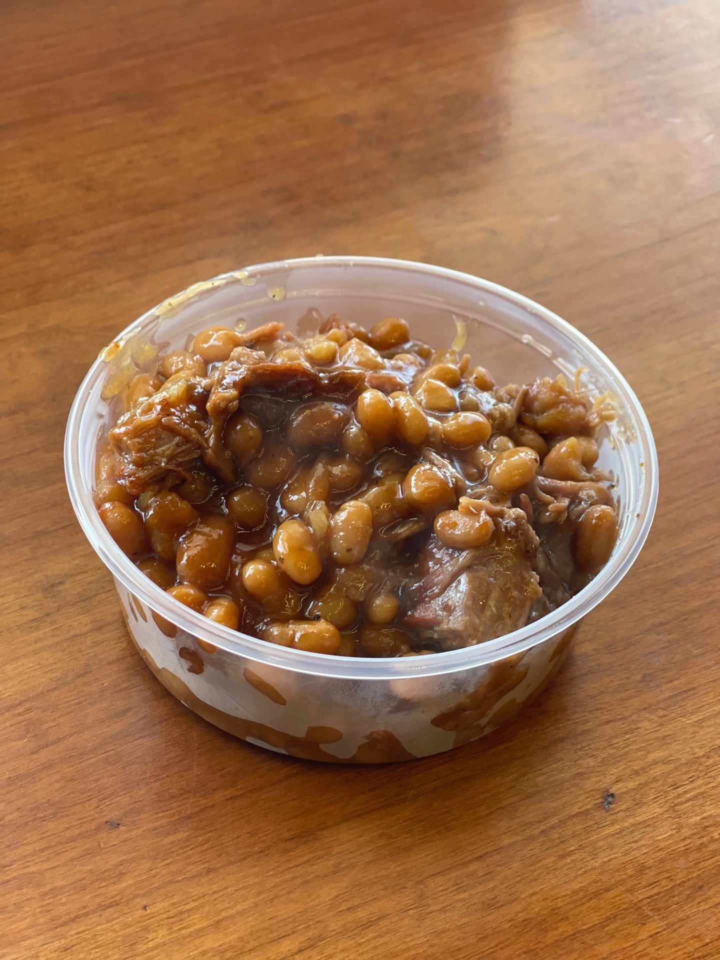 Half tray smoked baked beans with chopped brisket. | Smokin Grate BBQ